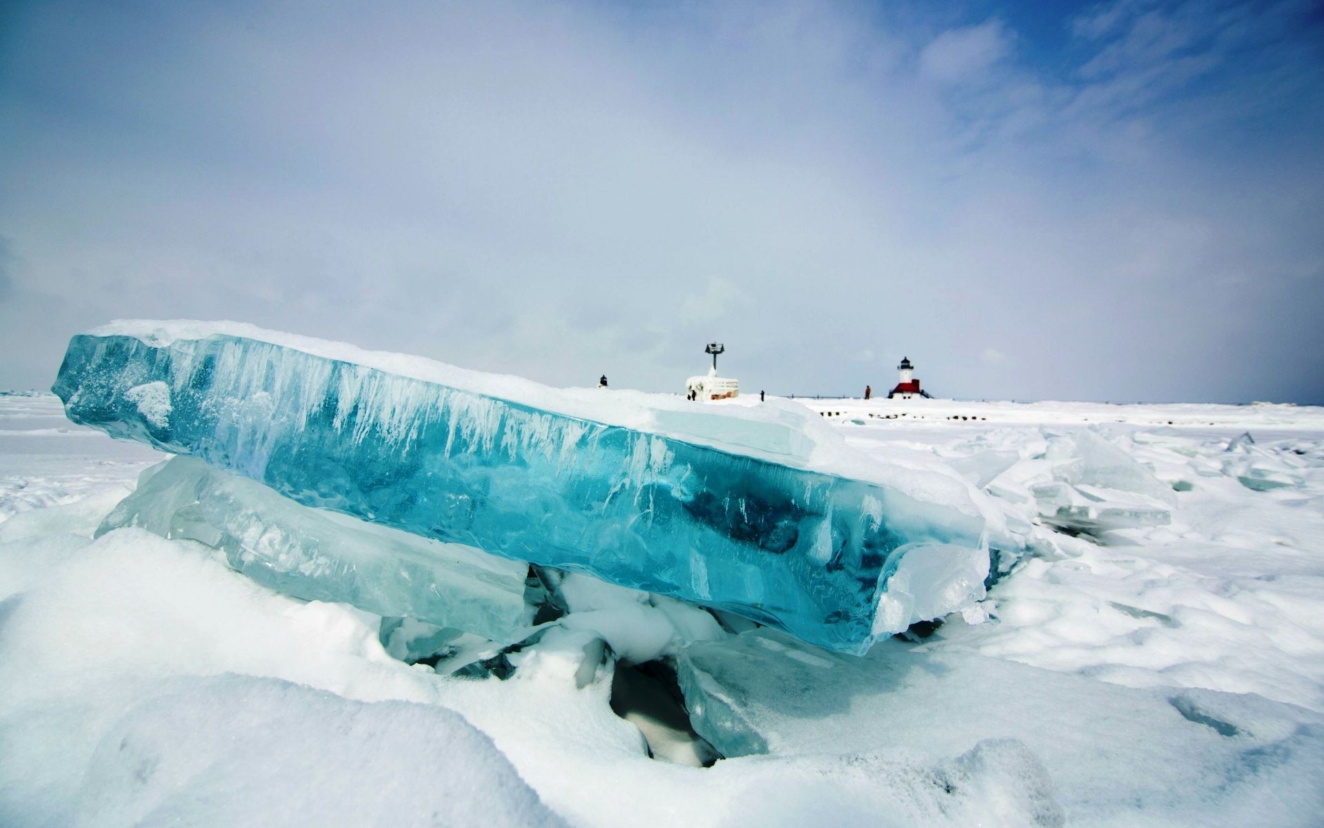 Large Blue Ice Chunk On A Frozen Landscape With Lighthouses Hd Large Blue Ice Chunk On A Frozen Landscape With Lighthouses Hd