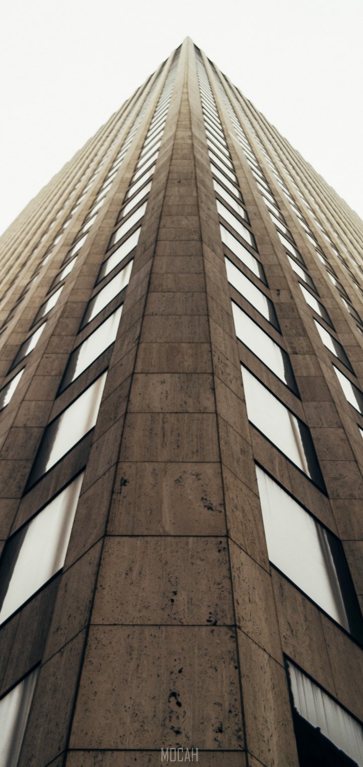 a low angle shot of a monumental high rise in new orleans, skyscraper ...